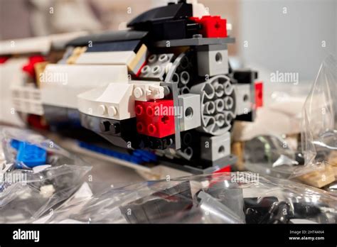 Assembling A Rocket Constructor Colored Plastic Small Blocks Stock