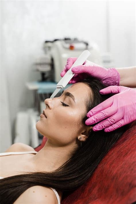 Ultrasonic Facial And Chin Peeling For Girl With Ultrasonic Scrubber In