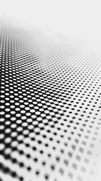 A Monochrome Dot Grid Pattern With Evenly Spaced Black Dots Against A