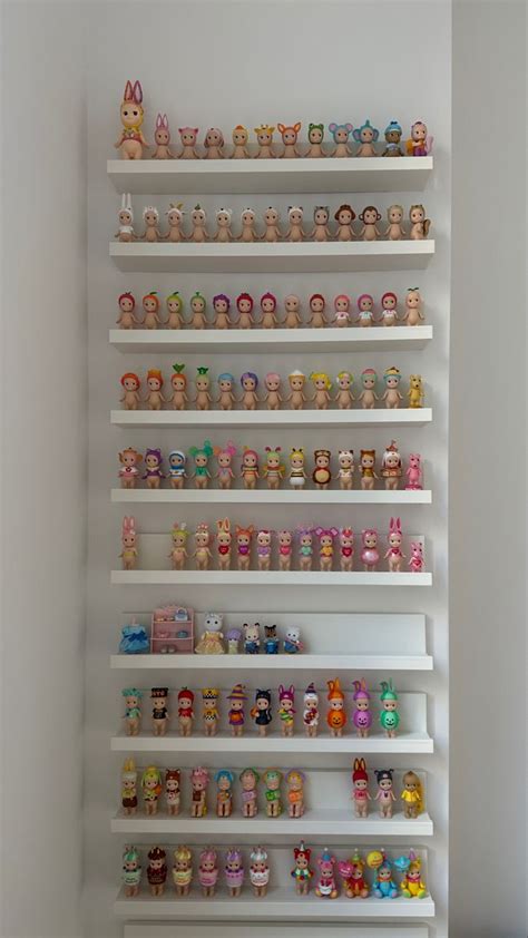 The Shelves Are Filled With Many Different Types Of Dolls