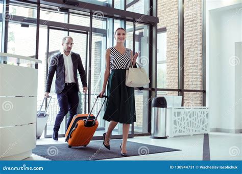 Beautiful Wife Accompanying Her Successful Husband On Business Trip