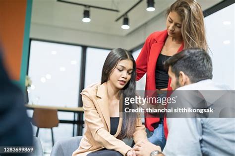 Shot Of Wife Hold Hands Consoling Her Husband During Counseling Session