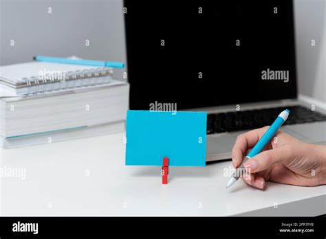 Businesswoman Holding Pen On Desk With Lap Top Books And Note With Important Data Woman Having