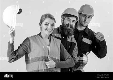 Builder Architect Engineer As Friendly Team Woman And Men Stock