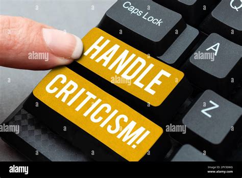 Hand Writing Sign Handle Criticism Word Written On Process Of