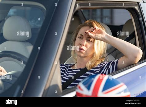 Tired Exhausted Woman Driver Looking At Jam Through Windshield Of