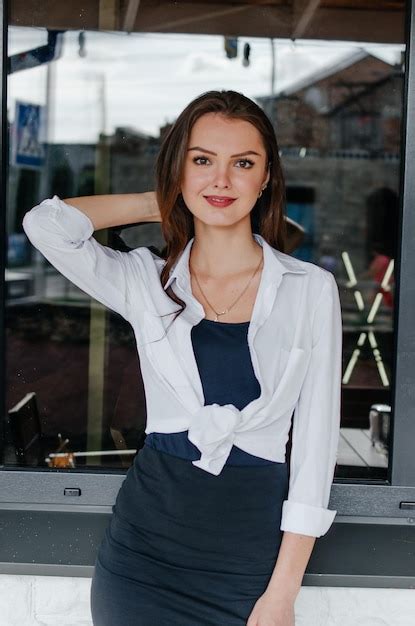 Premium Photo Girl In A White Shirt Posing For The Camera