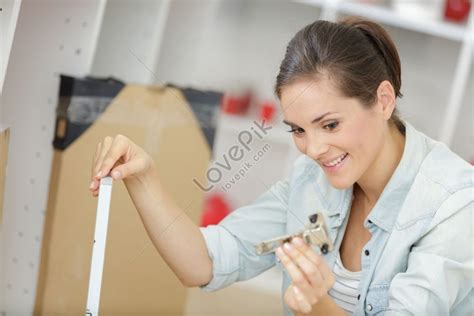 Housewife Assembles Wooden Furniture At Home Picture Picture And Hd Photos Free Download On