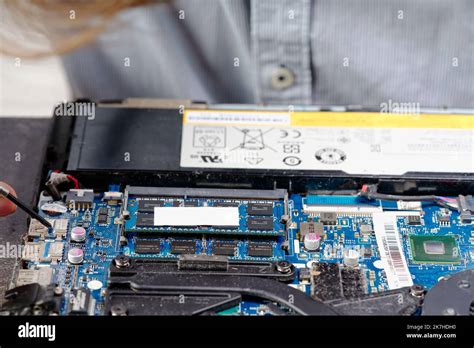 Man Disassembles A Laptop Computer Service And Repair Concept Laptop