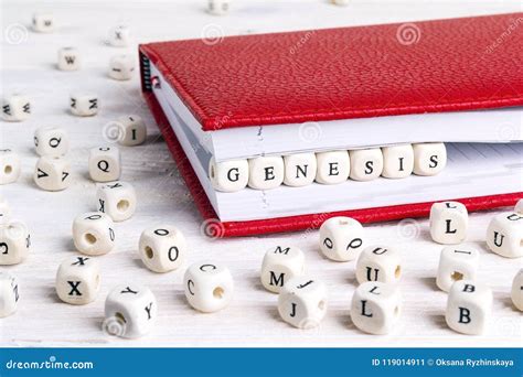Word Genesis Written In Wooden Blocks In Red Notebook On White W Stock