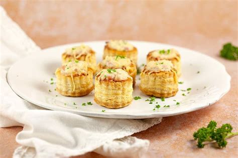 Small Pastries On A White Plate With Parsley