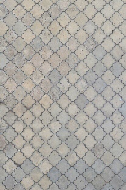 Premium Photo The Texture Of A Rhythmic Mosaic Made Of Concrete Tiles