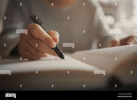 Student Preparing For College Test Exam Reading Book Studying