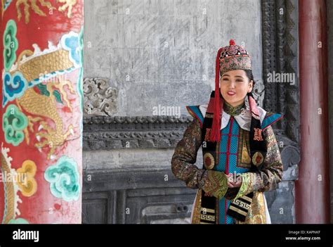 Mongolian Woman In Traditional Outfit Near Old Temple In Ulaanbaatar