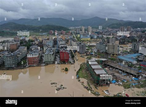 The Residential Buildings And Fields Are Submerged In Floodwater After