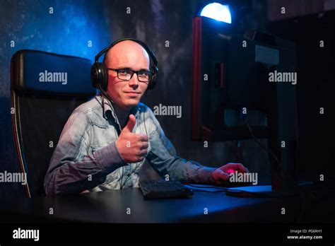 Adult Gamer Sits At Home With A Computer Shows A Thumbs Up And Looks Into The Camera A Man