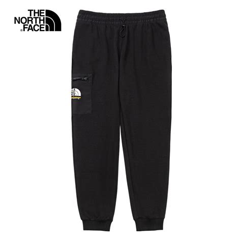 【the North Face 官方旗艦】北面女款黑色側邊品牌標語印花運動休閒長褲｜7webjk3 長褲 Yahoo奇摩購物中心