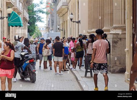Havana Cuba Large Group Of People Lining Up In The Exterior Of Bank