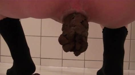 Milf Pushing Out A Huge Turd On The Floor