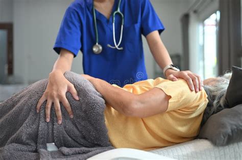 Female Physiotherapist Or Chiropractor Doing Manipulative Spine