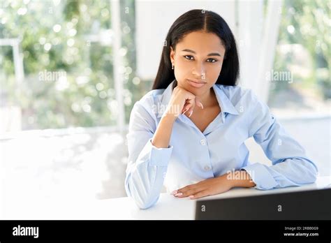 Confident Pretty Black Businesswoman In Modern Office With Copy Space