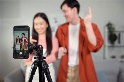 Premium Photo Asian Young Couple Tiktokers Are Making Video Dancing