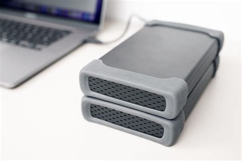Premium Photo Close Up Of External Hard Drives Storage Connected To A Modern Laptop Computer