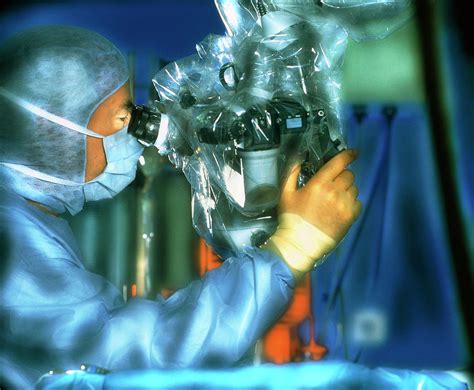 Surgeon Using A Microscope During Microsurgery Photograph By Jesse