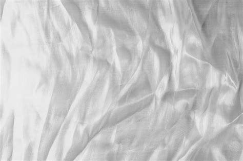 배경 질감 패턴입니다 직물은 흰색입니다 우아하고 섬세 한 화이트 실크 직물 배경입니다 밝은 공단 직물 배경으로 사용 하기 위해 접혀 직물 섬유 표면의 위 유형입니다 0명에
