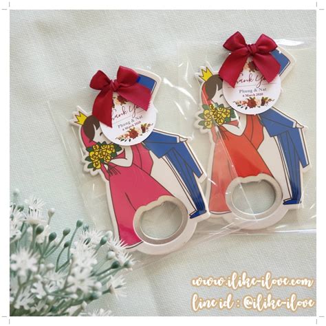 [เซตละ50ชิ้นตกชิ้นละ9บาท] ของชำร่วยงานแต่ง ที่เปิดขวดบ่าวสาวใส่หมวกแพ็คถุงใส Kwankaew Shop