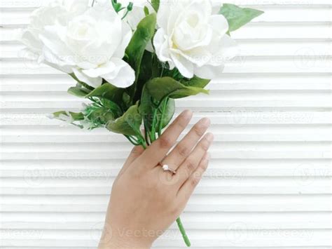 A Young Girl From Indonesia Wearing A Wedding Ring On Her Middle Finger