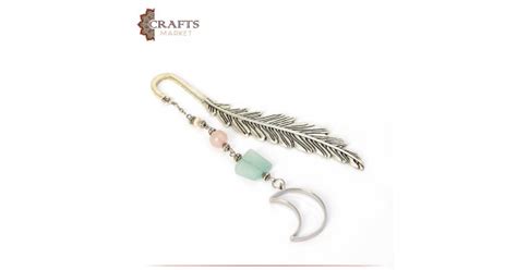 Book Separator With A Feather Design And A Crescent Shaped Pendant