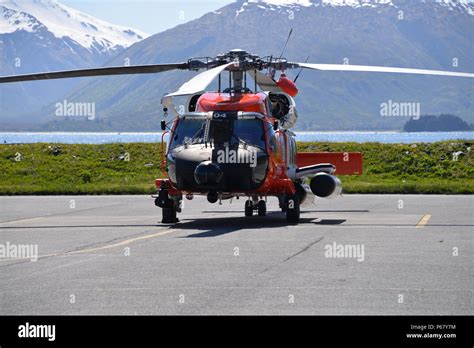 A Coast Guard Mh 60 Jayhawk Helicopter Sits On The Runway In Kodiak