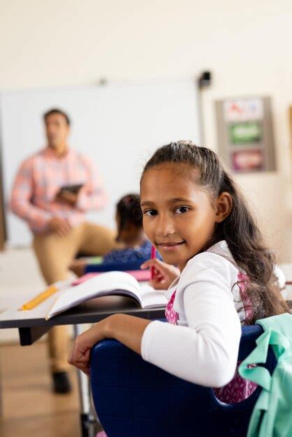Premium Photo Portrait Of Happy Biracial Elementary Schoolgirl