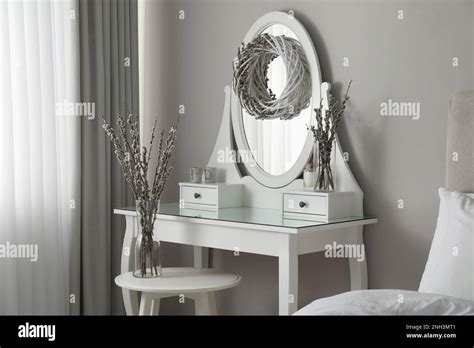 Elegant Dressing Table Decorated With Pussy Willow Branches Indoors