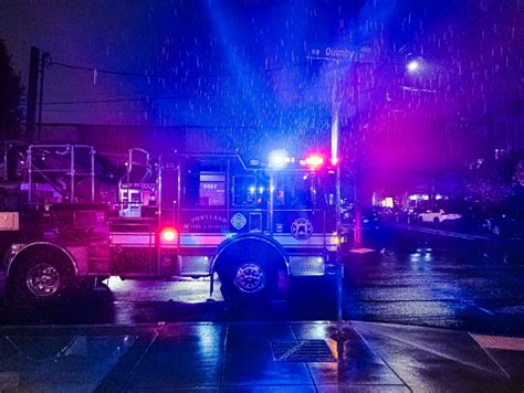 Fire Truck With Flashing Lights At Night Called To A Fire Alarm In The