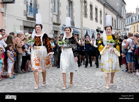 Brittany France Women In Traditional Costume And Hats Parading In The