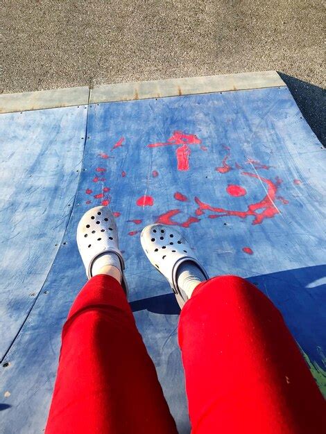 Low Section Of Woman On Slide Premium Photo