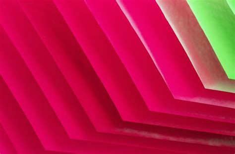 Premium Photo A Pink Plastic Container With A Green Background