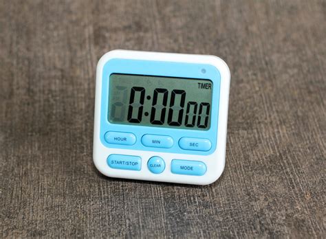 Digital Kitchen Timer White Color And Light Blue Color On Dark
