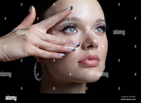 Portrait Of Female Face With Unusual Rhinestones Makeup Woman With