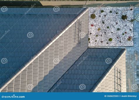Closeup Of House Roof Top Covered With Ceramic Shingles Tiled Covering