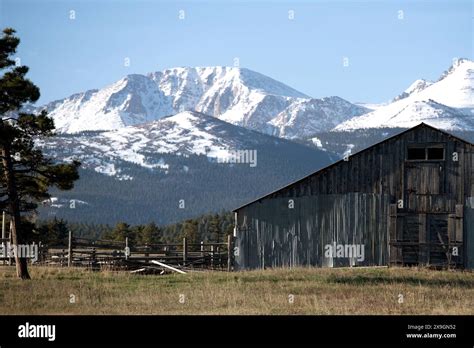 An Old Barn In The Foreground With The Snow Covered North Face Of