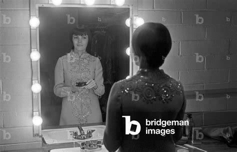 Image Of French Singer Mireille Mathieu Looking In The Nmirror In Her