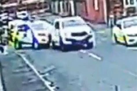 Moment Driver Rams Into Police Car Before Speeding Off Leaving Two
