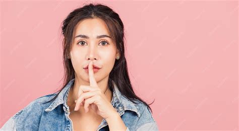Premium Photo Woman Wear Denim Smile Stand Making Finger On Lips