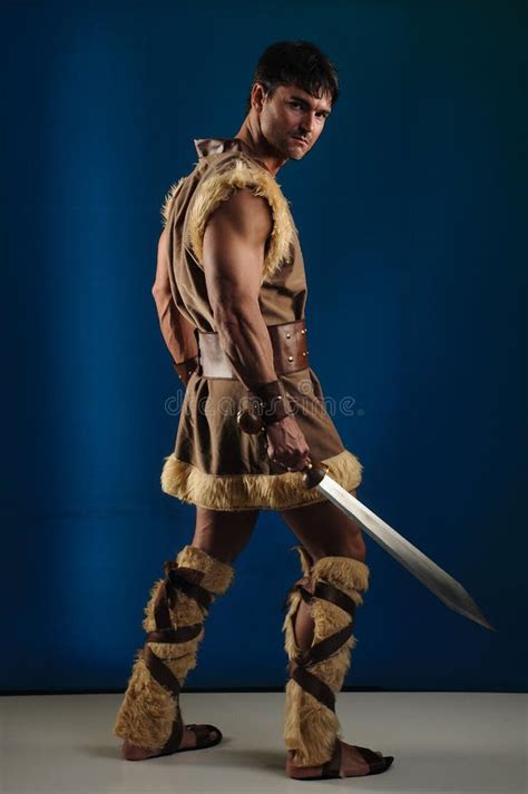 The Gladiator Strikes A Unique Pose Stock Photo Image Of Moodiness