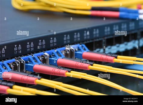 Switch With Fiber Optic Cables In Data Center Stock Photo Alamy