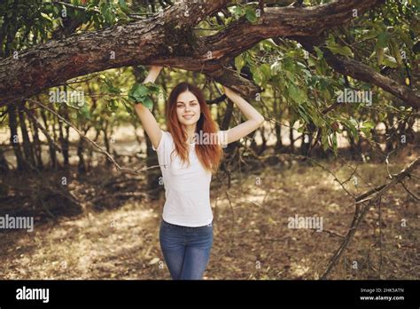 Woman Touching Tree Branch With Hands On Nature In Summer Garden Stock Photo Alamy