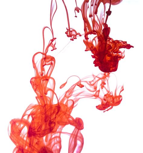 Premium Photo Red Ink Dropped Into Water Isolated On White Background